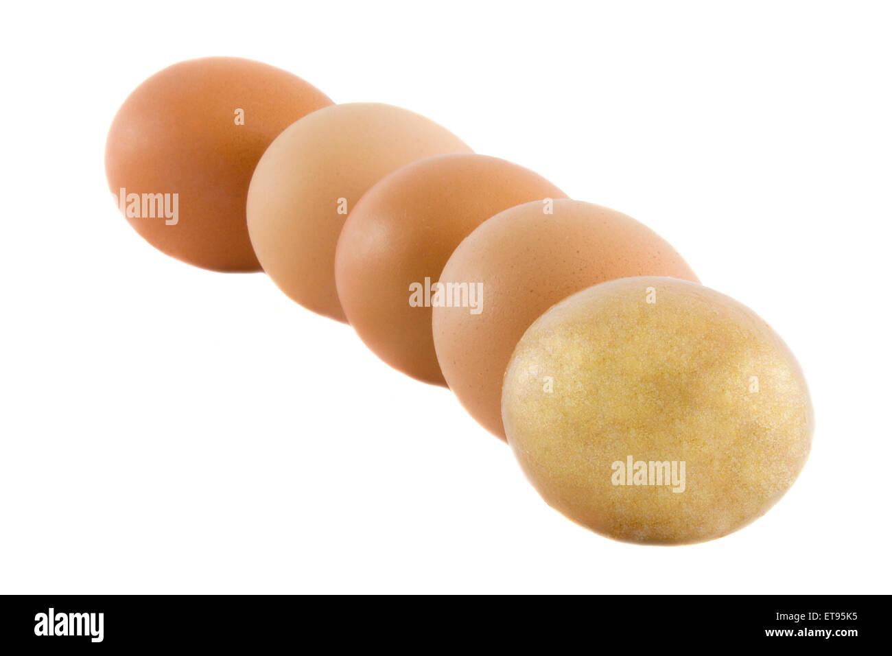 One golden and many ordinary fresh rural eggs isolated over whit Stock ...