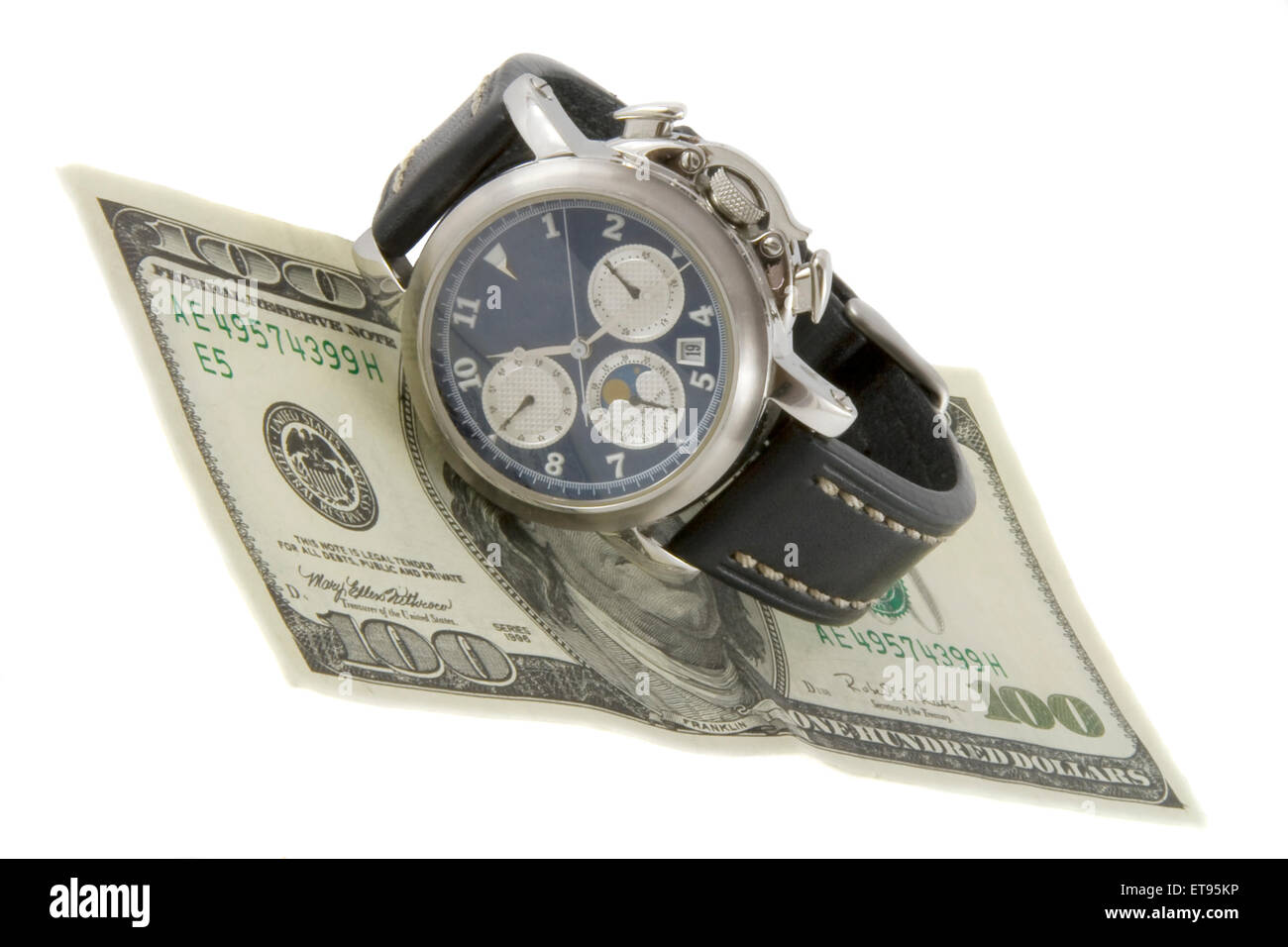 Time is money. Watch and hundred dollars banknote isolated over Stock ...