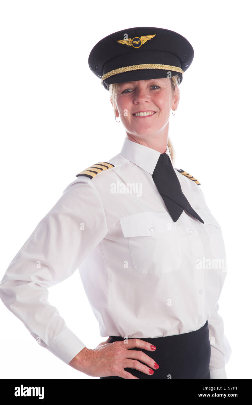 Attractive female airline pilot standing in uniform Stock Photo - Alamy