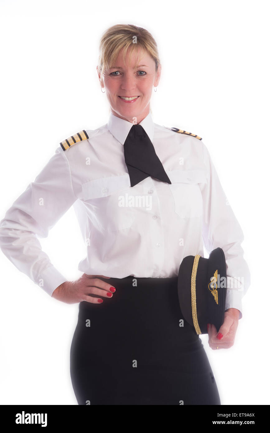 Attractive female airline pilot standing in uniform Stock Photo - Alamy