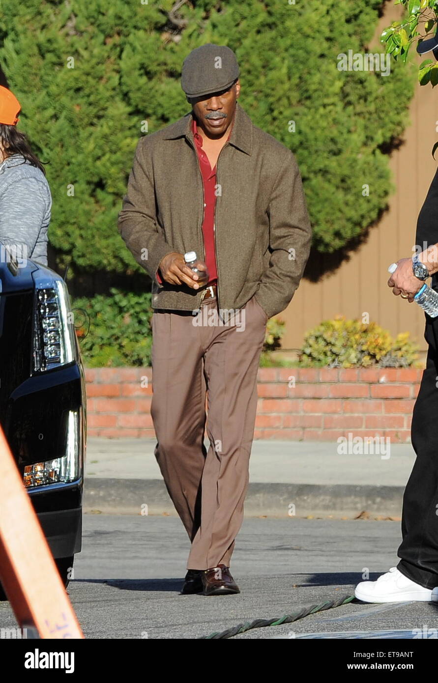 Actor Eddie Murphy sports a grey mustache and 70's attire on the set of ...