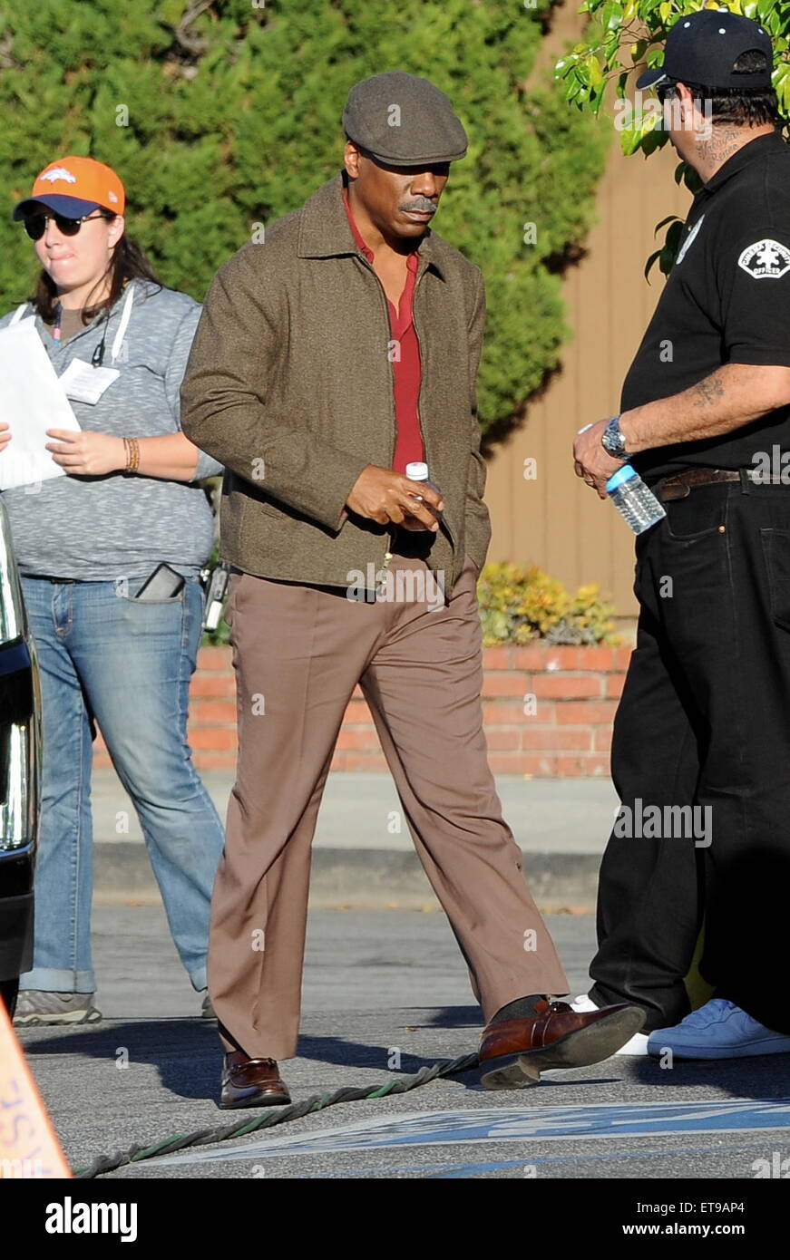 Actor Eddie Murphy sports a grey mustache and 70's attire on the set of ...