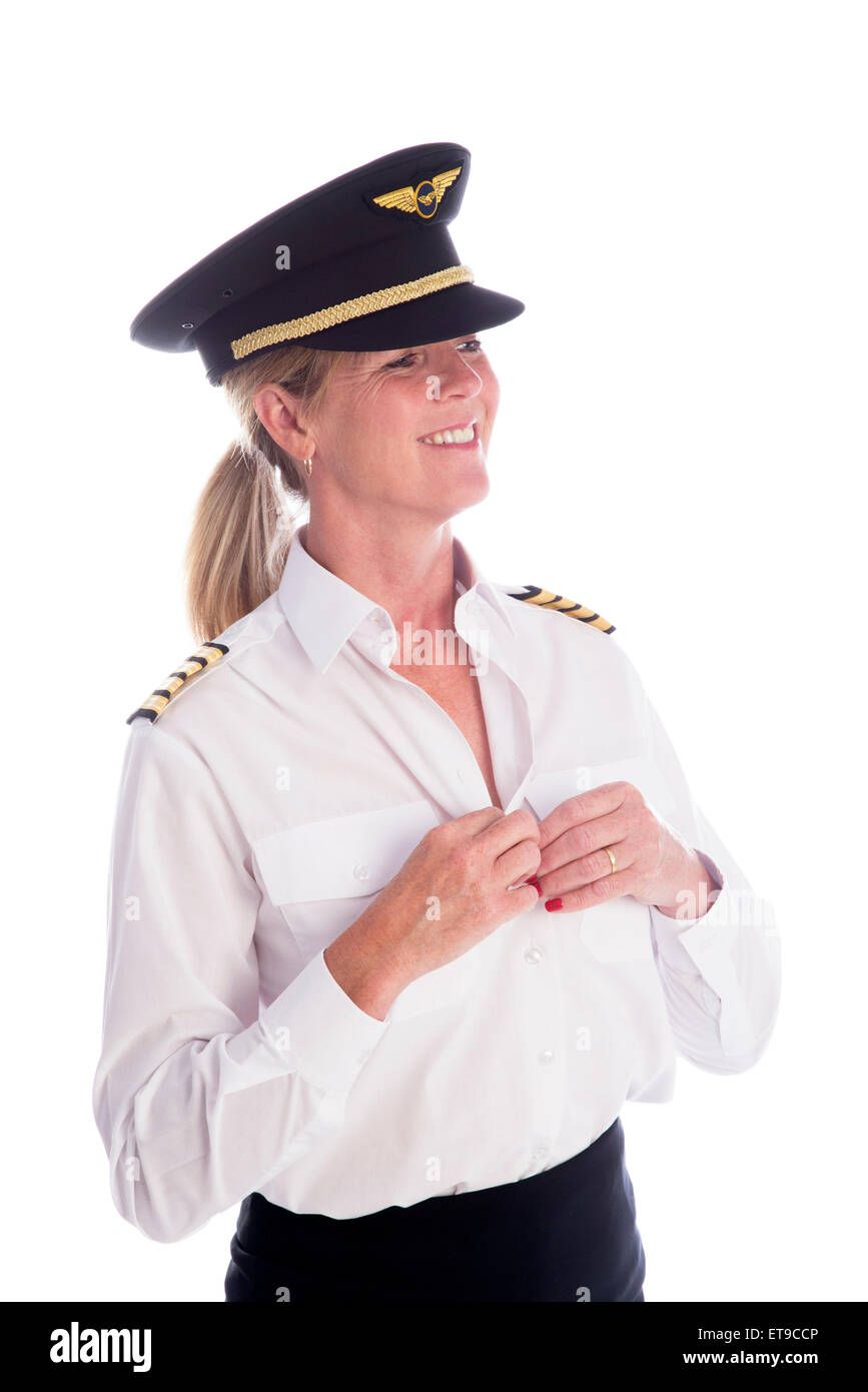 Attractive female airline pilot getting dressed Buttoning her uniform ...
