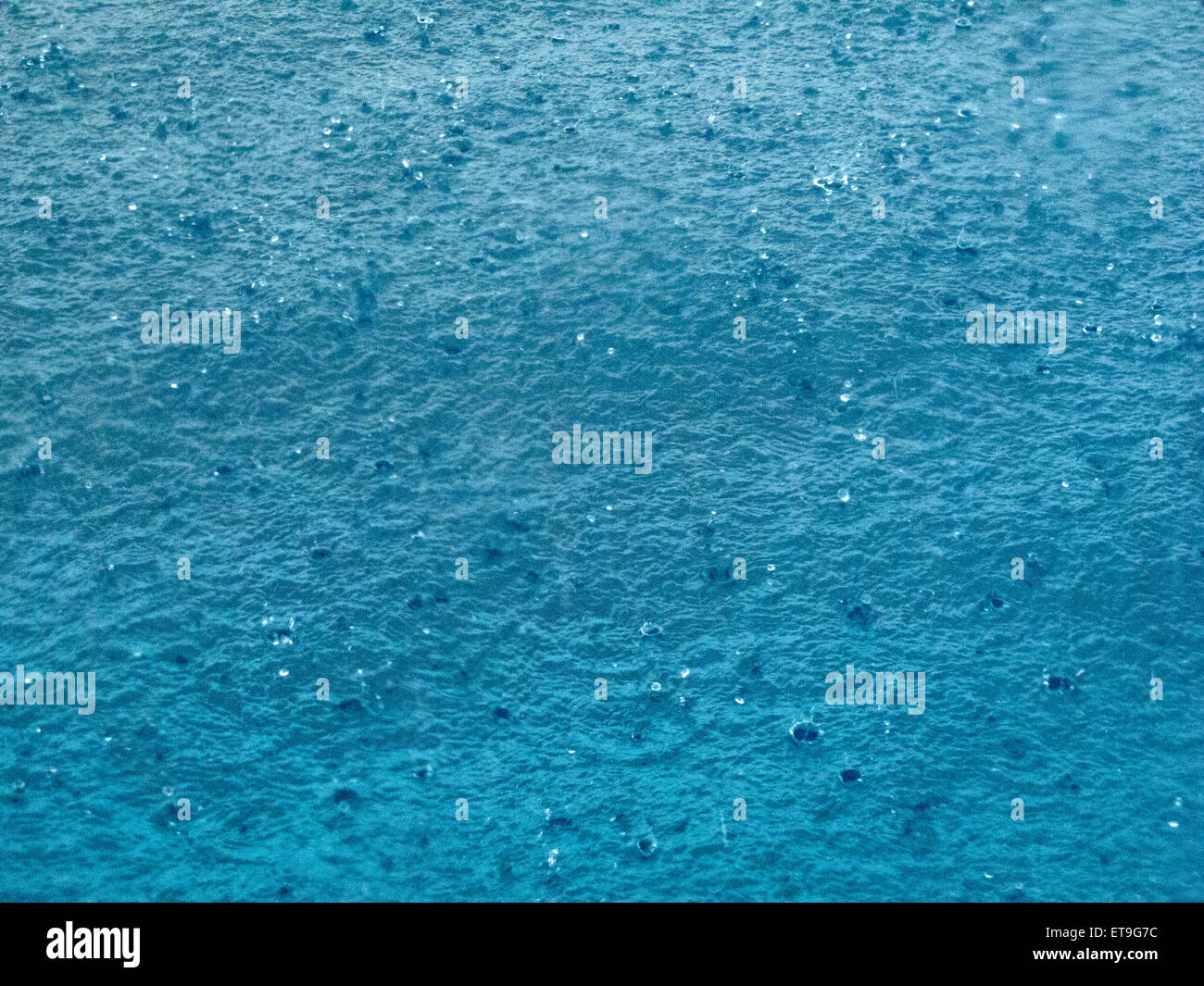Rain drops on the surface of the water Stock Photo - Alamy
