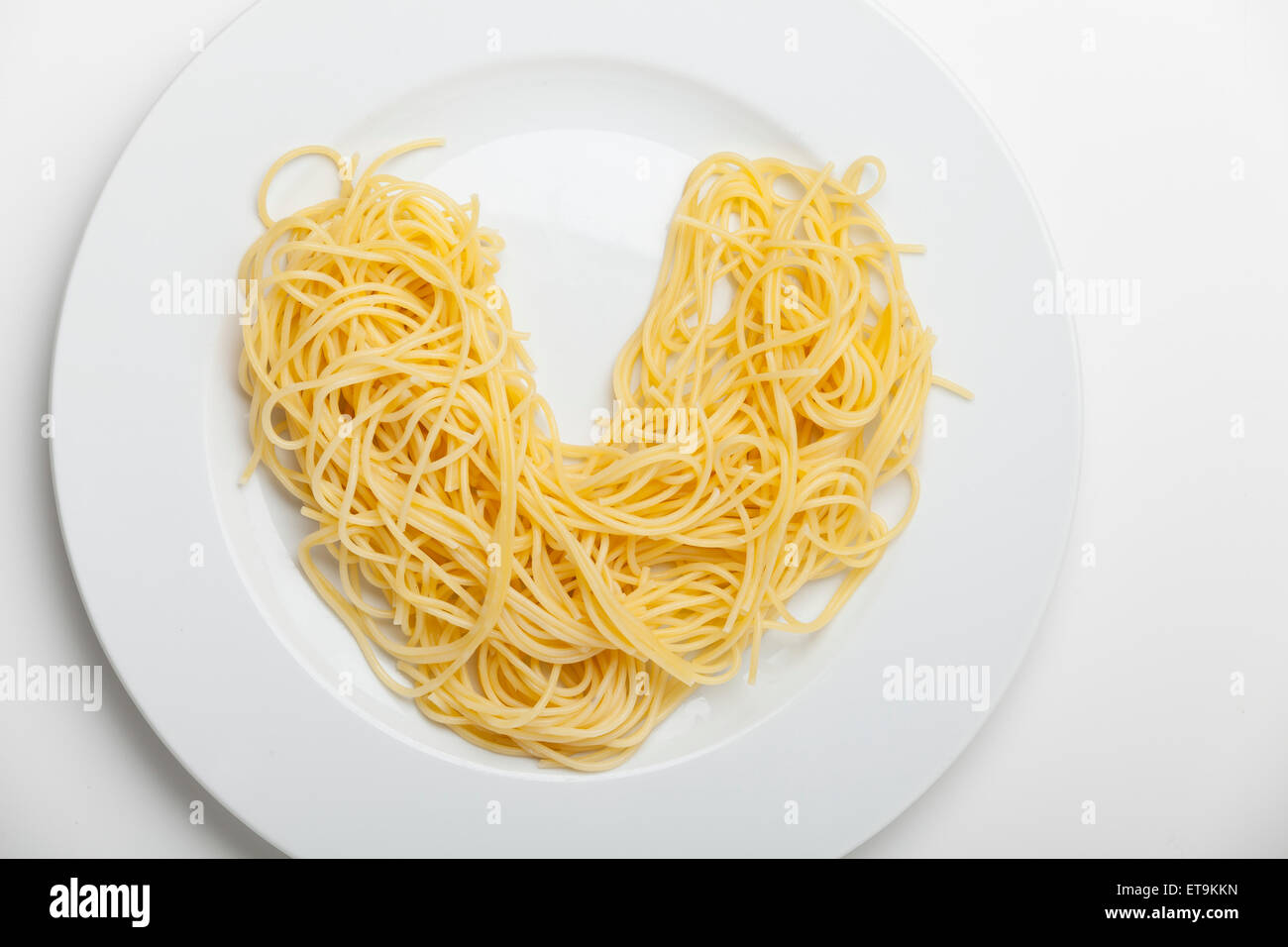 heart shaped spaghetti on a plate Stock Photo - Alamy