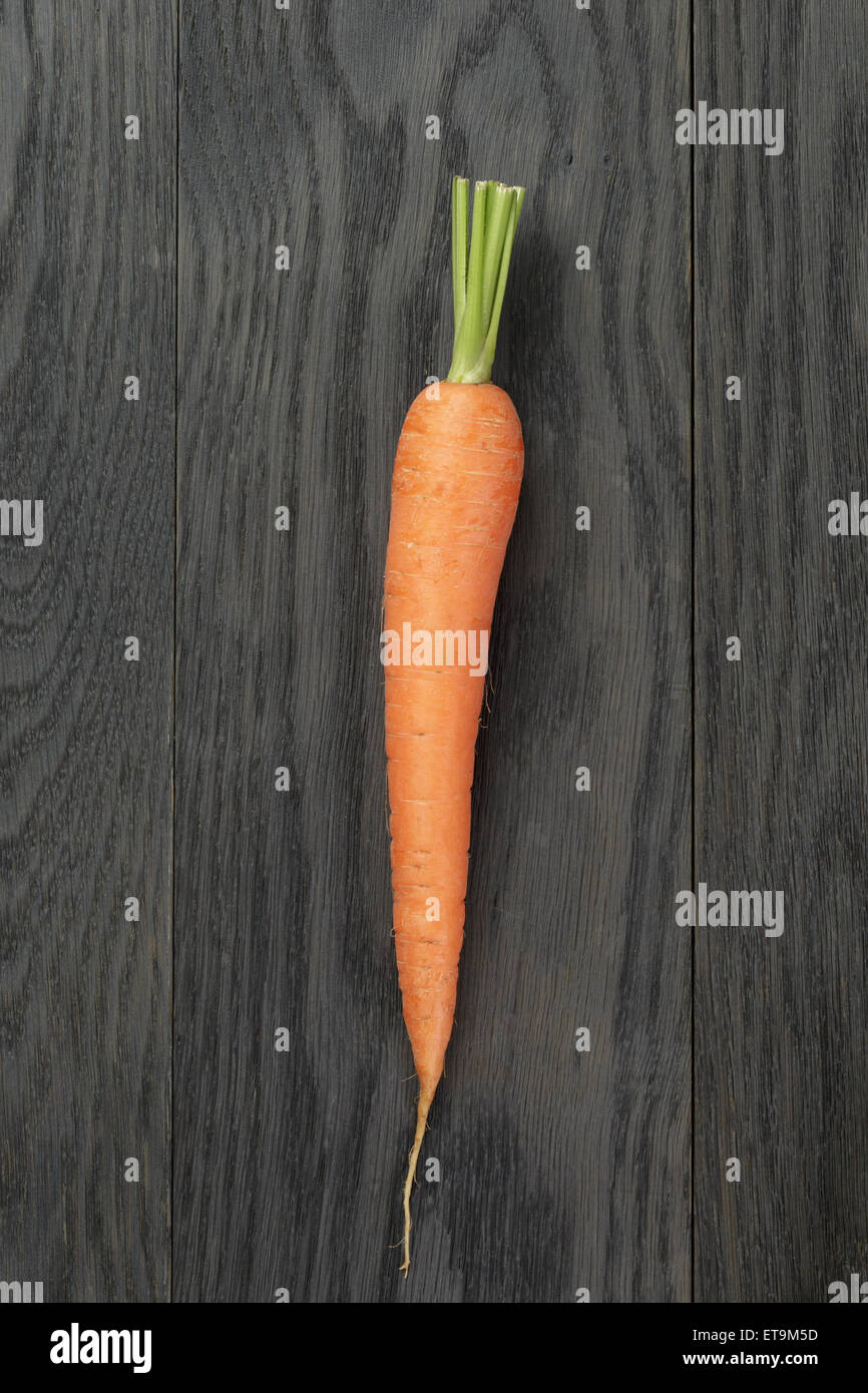 fresh carrot on old oak table top view Stock Photo - Alamy