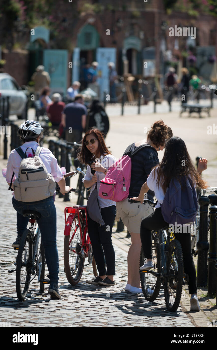 Girls riding bikes on the Quay, Exeter, Devon, UK Stock Photo - Alamy