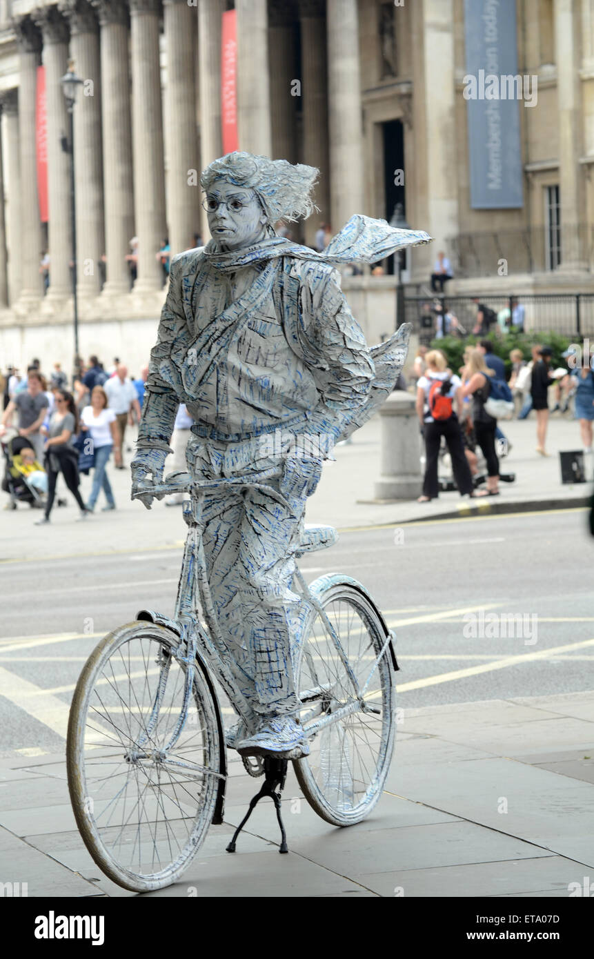 London, UK, 12 June 2015. Human statue cyclist in Trafalgar Square ...