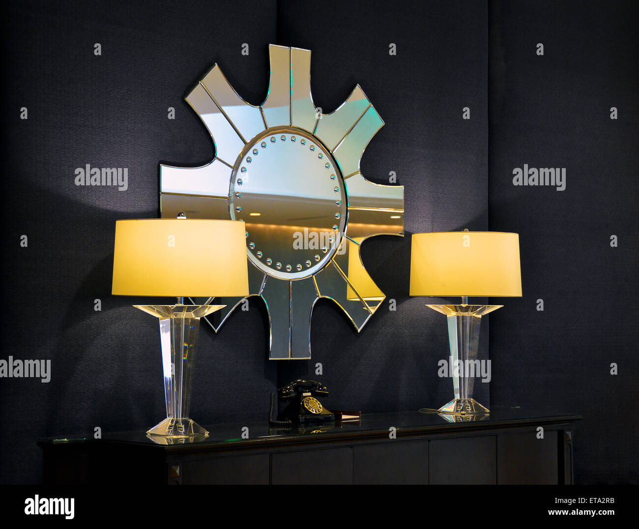 Glowing contemporary lamps with glass mirror on hotel lobby Stock Photo ...