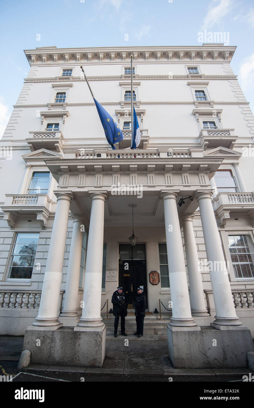 People leave tributes and security is tightened at the French Embassy ...