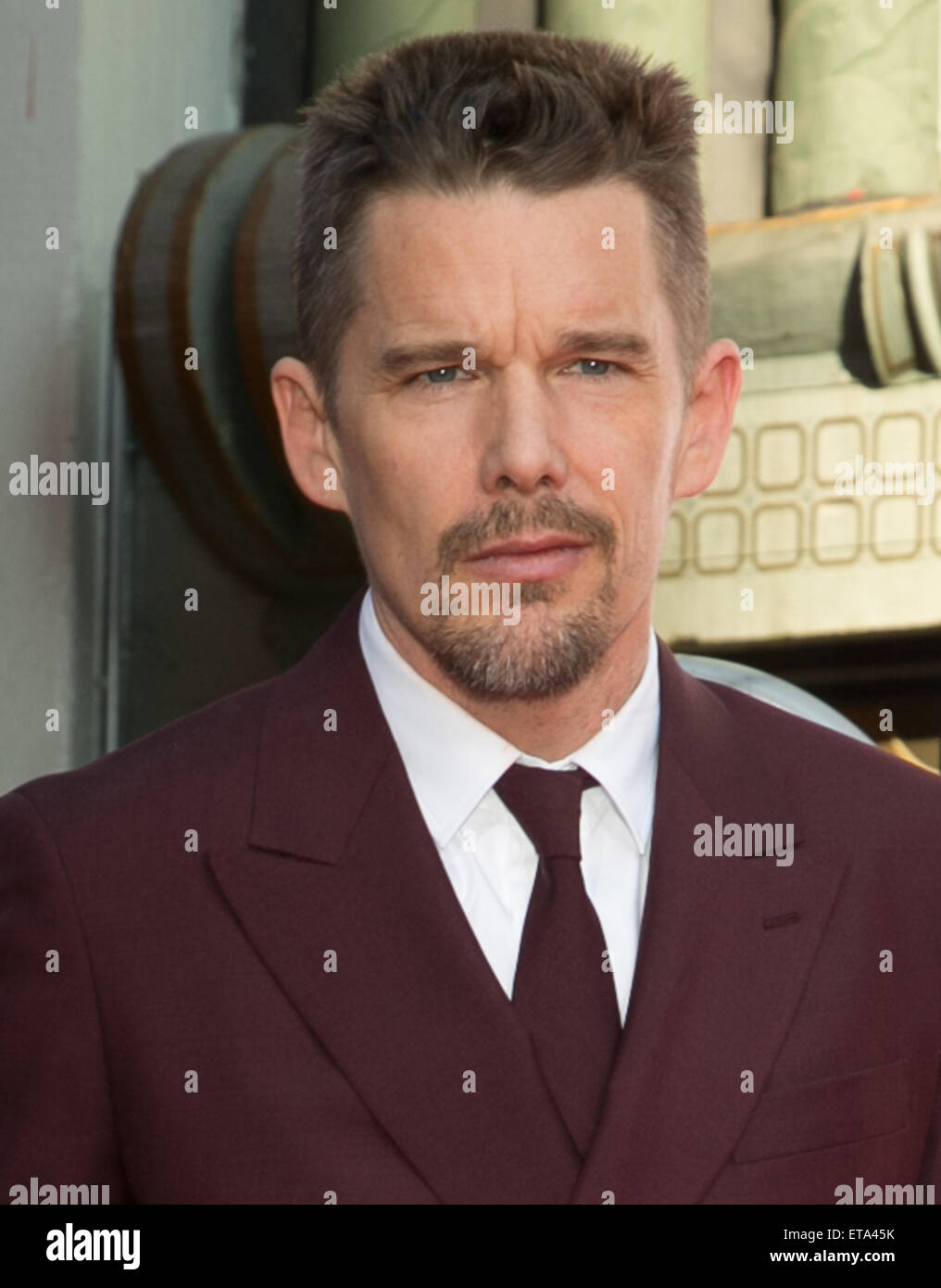 Actor Ethan Hawke places handprints and footprints in cement during his ...