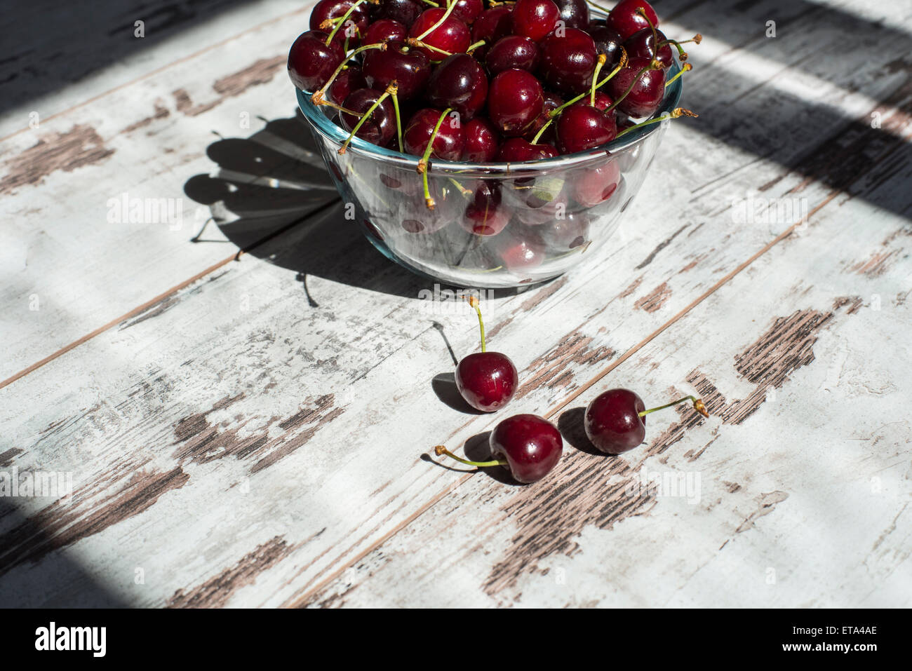 Dark red sweet cherries in transparent bowl Stock Photo - Alamy