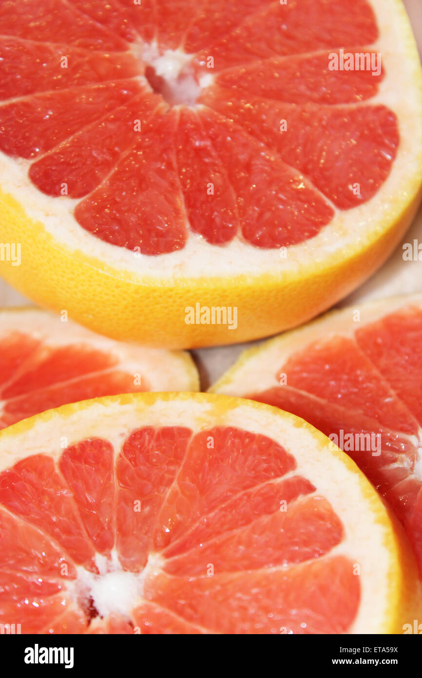 cut pieces of fruits of red grapefruit Stock Photo - Alamy
