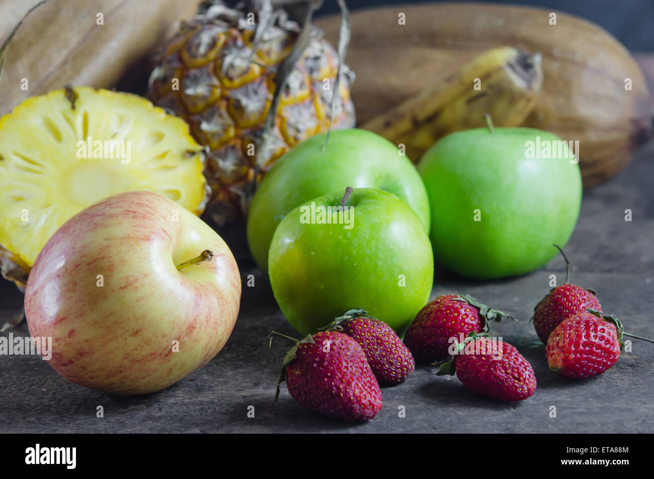 still life of mix fruits , apple with strawberry, pineapple and banana ...