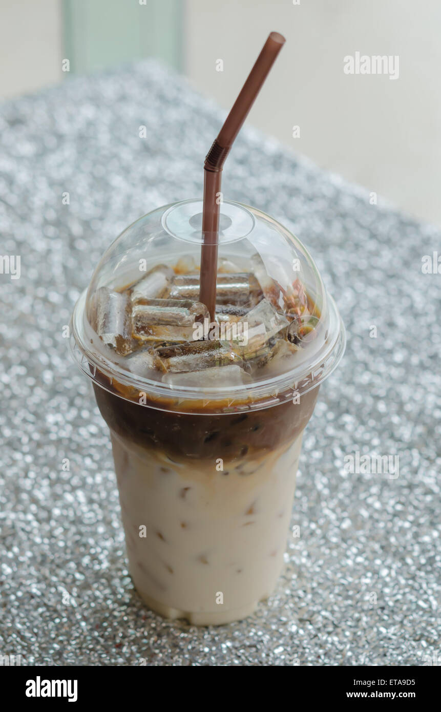 Iced coffee with straw in plastic cup for take aways Stock Photo - Alamy