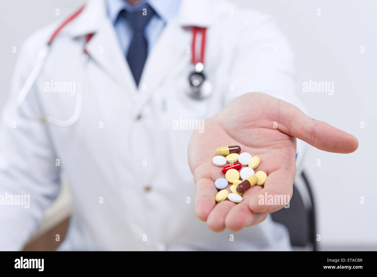 Professional doctor giving pills Stock Photo - Alamy