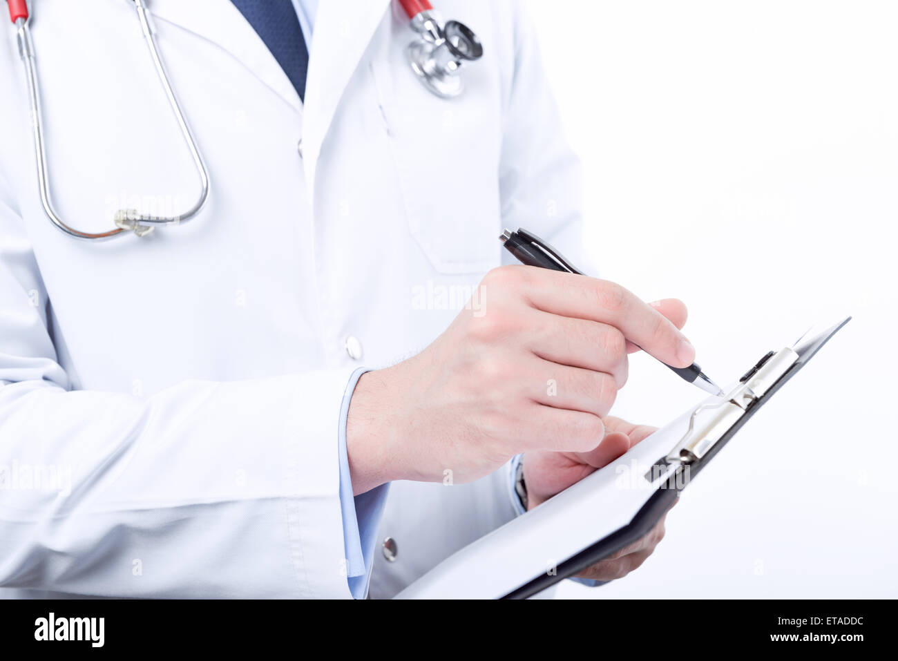 Professional doctor filling the papers Stock Photo - Alamy
