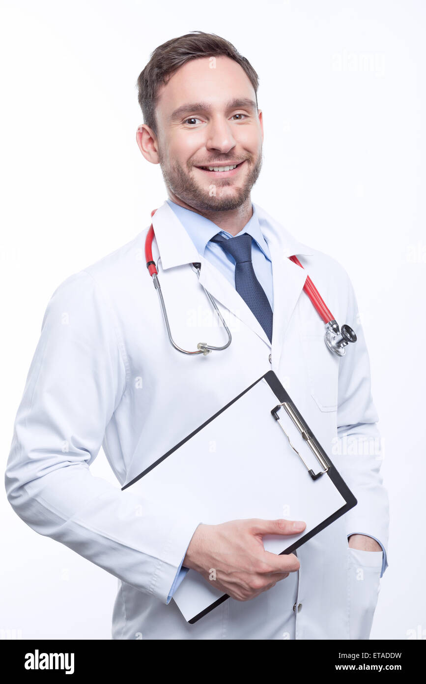 Smiling doctor holding the papers Stock Photo - Alamy