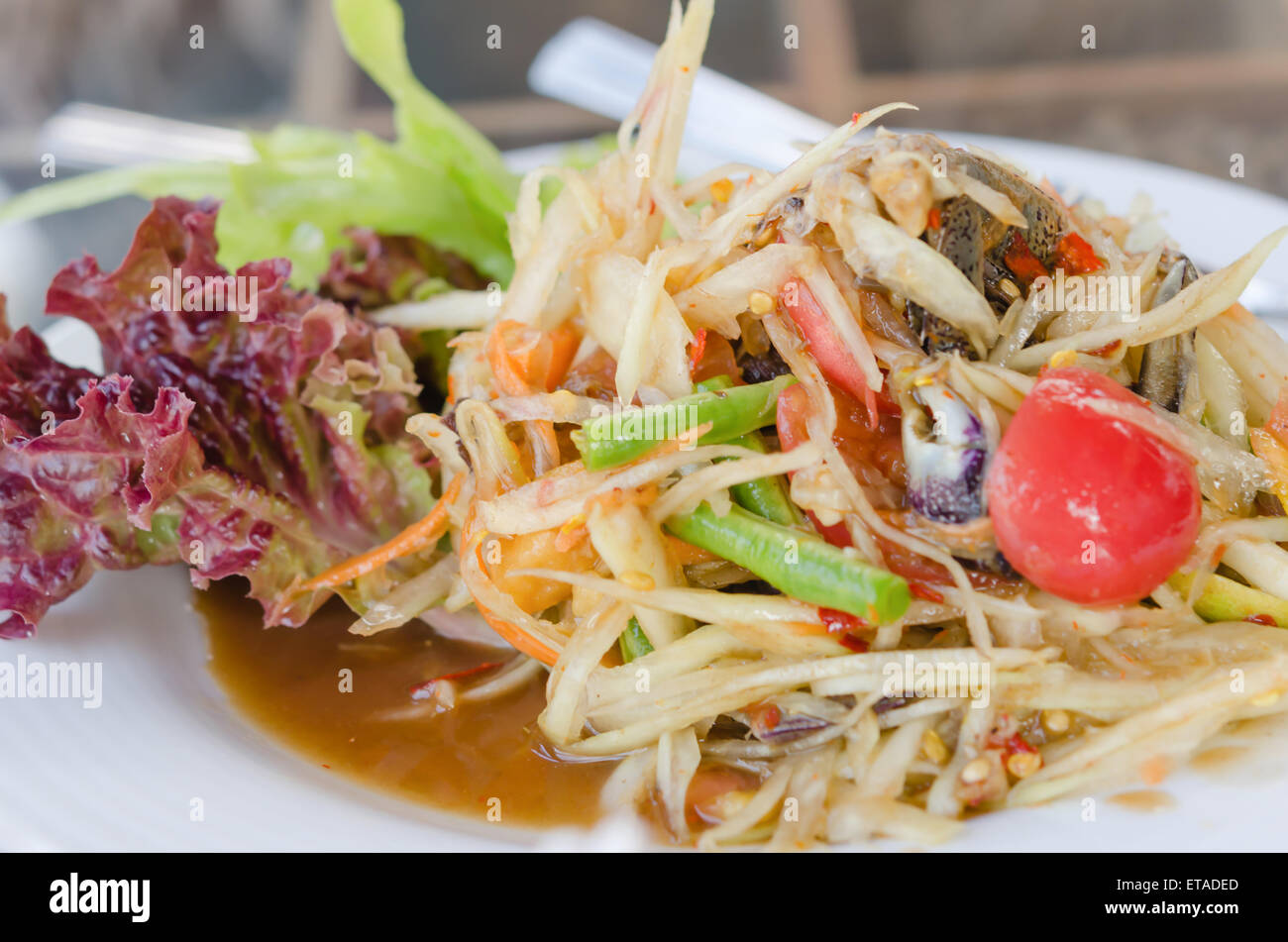 Thai spicy papaya salad serve with vegetables Stock Photo - Alamy