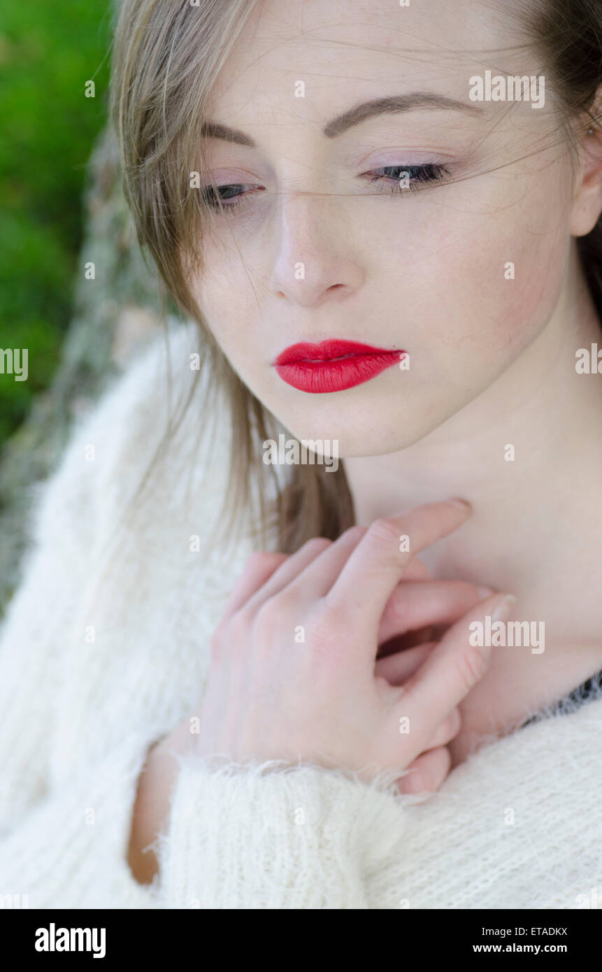 Beautiful young woman hands over heart Stock Photo - Alamy