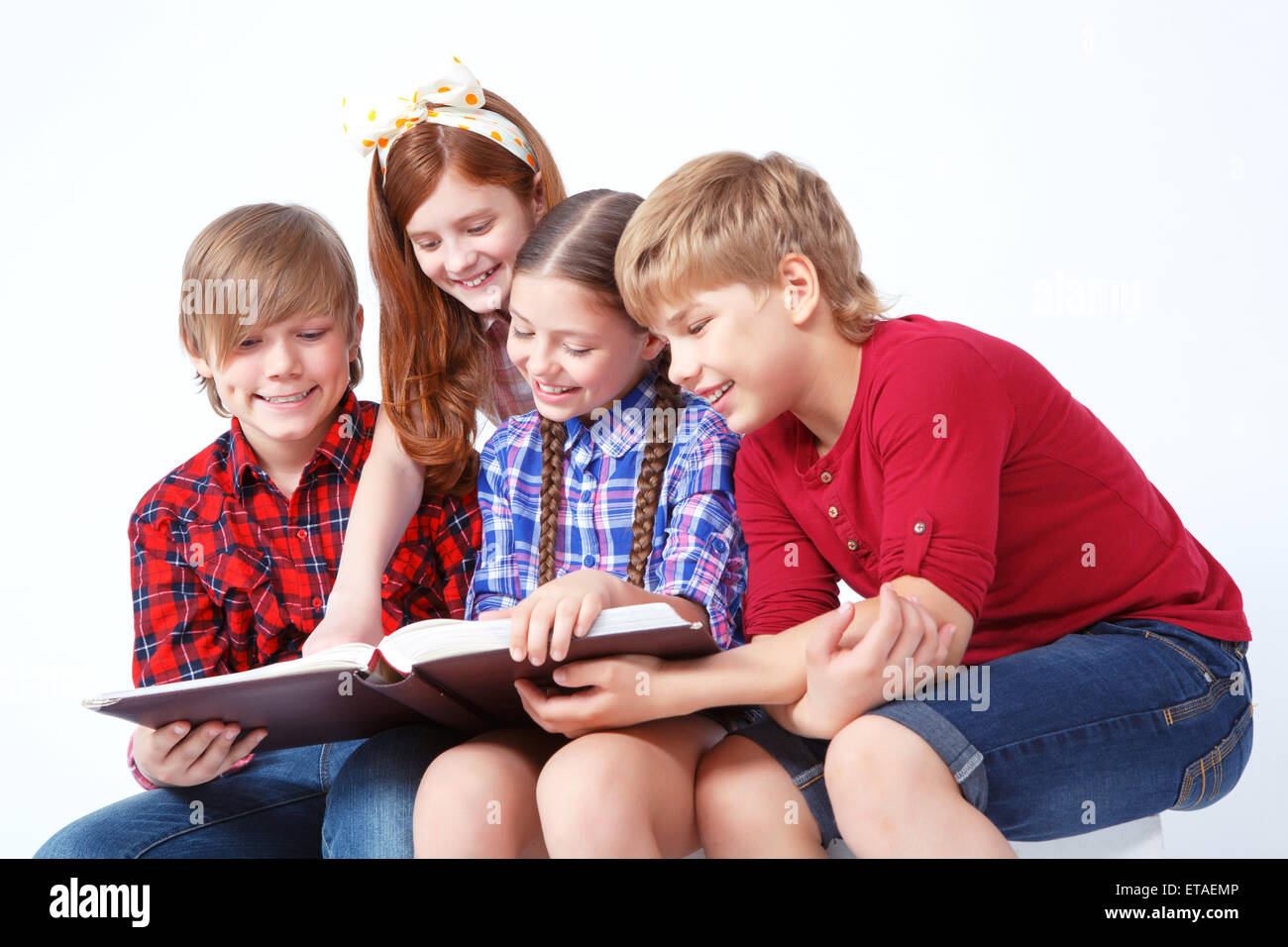 Nice children reading book Stock Photo - Alamy