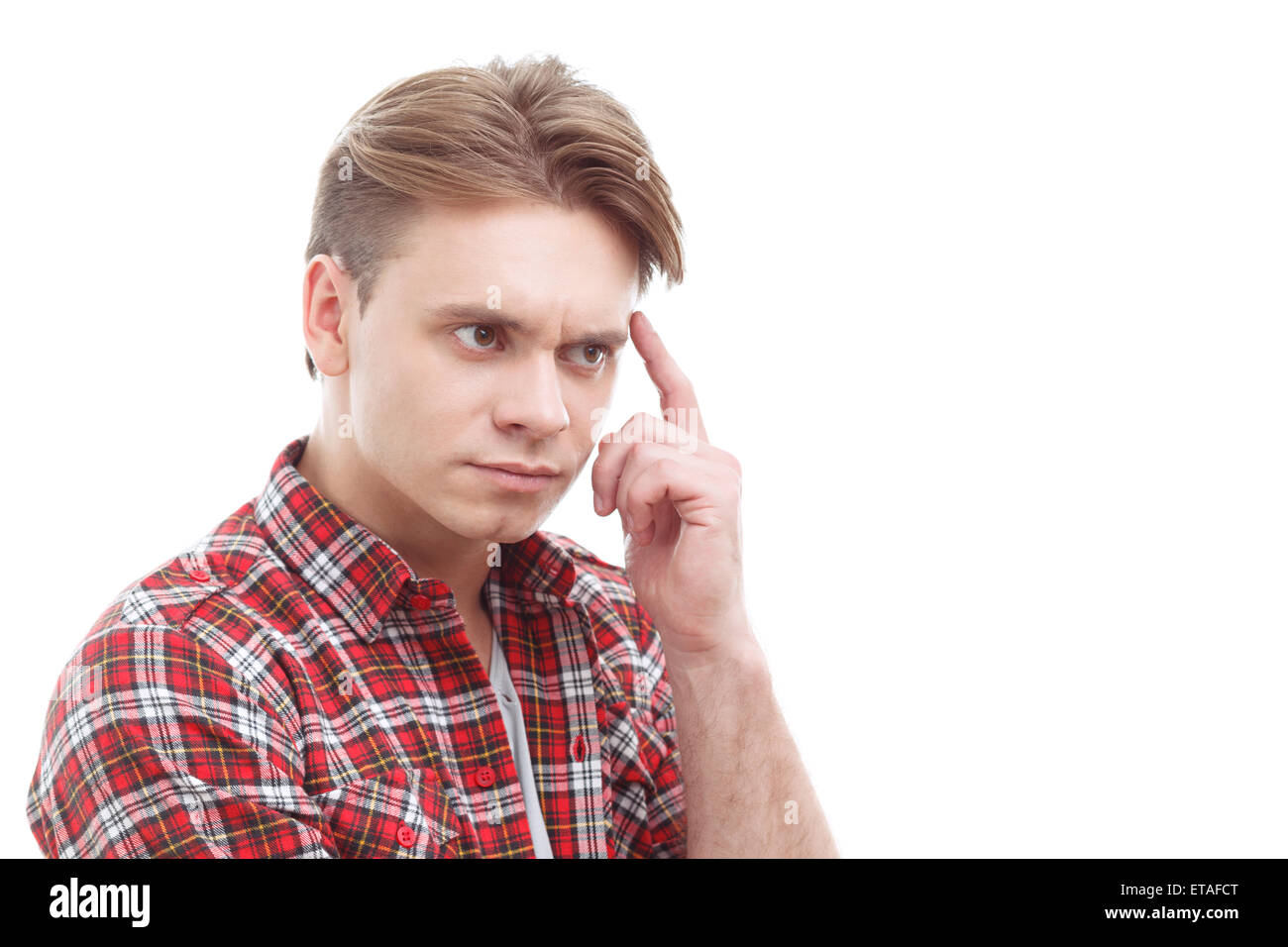 Puzzled guy involved in thinking Stock Photo - Alamy