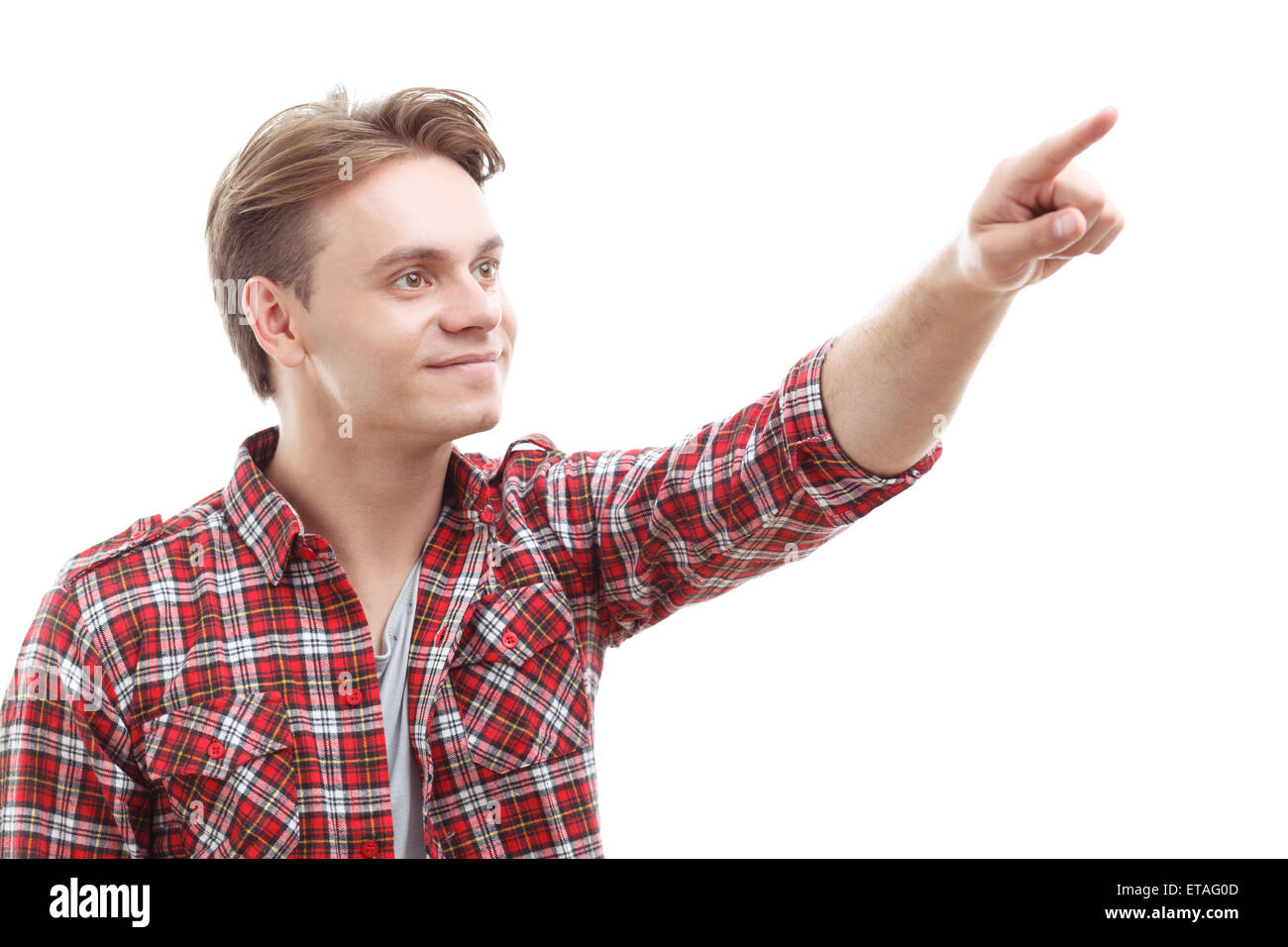 Inspired guy pointing with index finger Stock Photo - Alamy