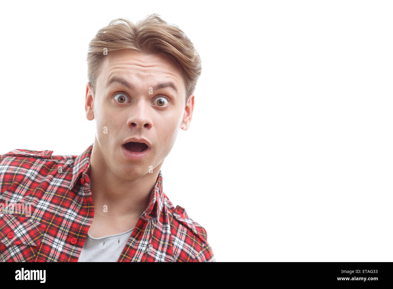 Astonished guy showing surprise Stock Photo - Alamy