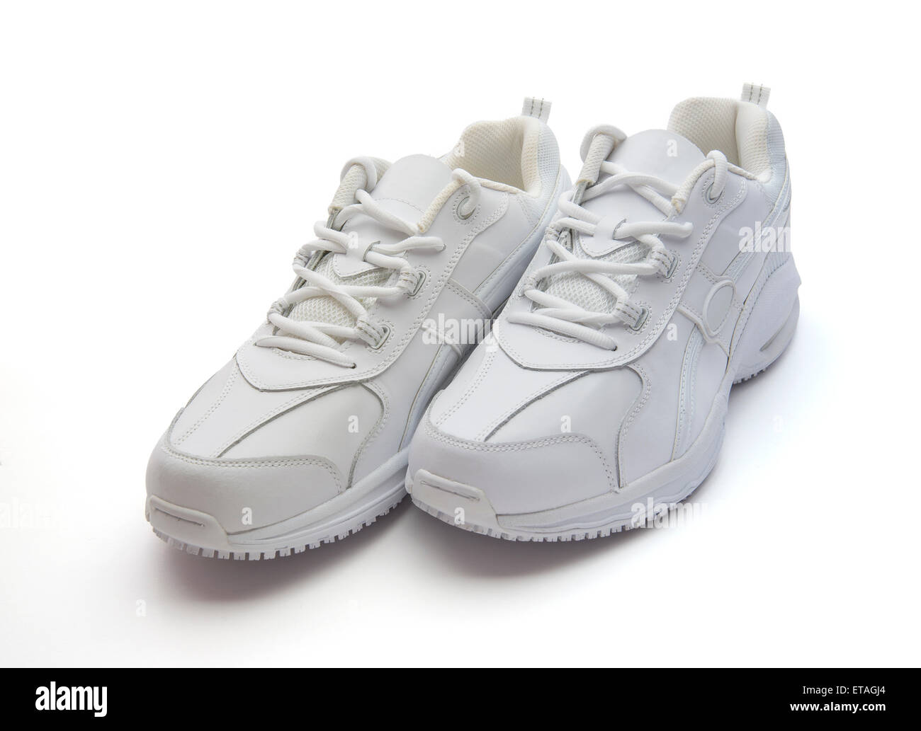 White athletic shoes on white background Stock Photo - Alamy