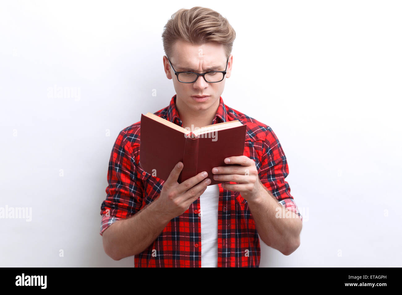 Smart guy involved in reading Stock Photo - Alamy