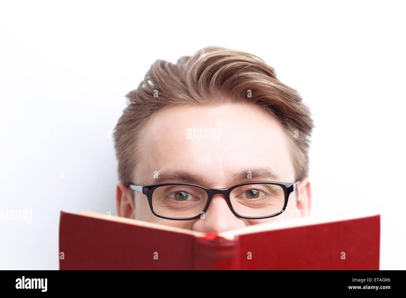 Smart guy involved in reading Stock Photo - Alamy