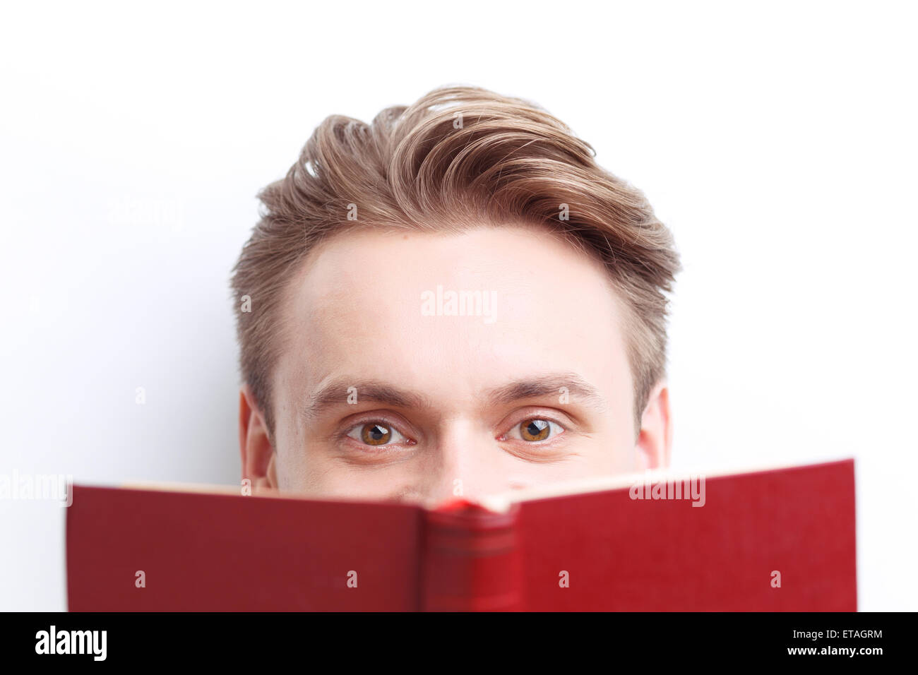Smart guy involved in reading Stock Photo - Alamy