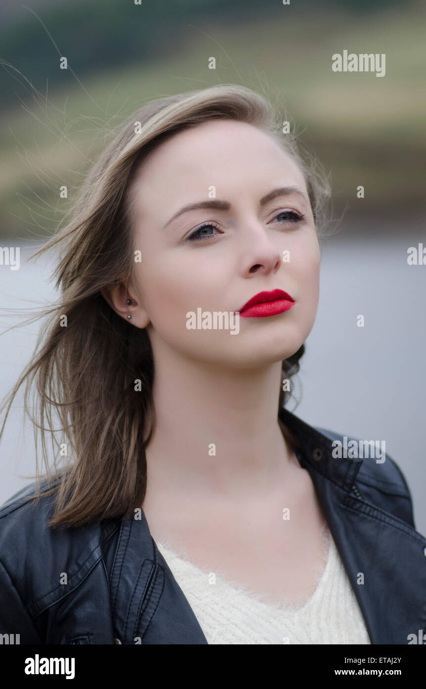 Beautiful young woman looking up Stock Photo - Alamy