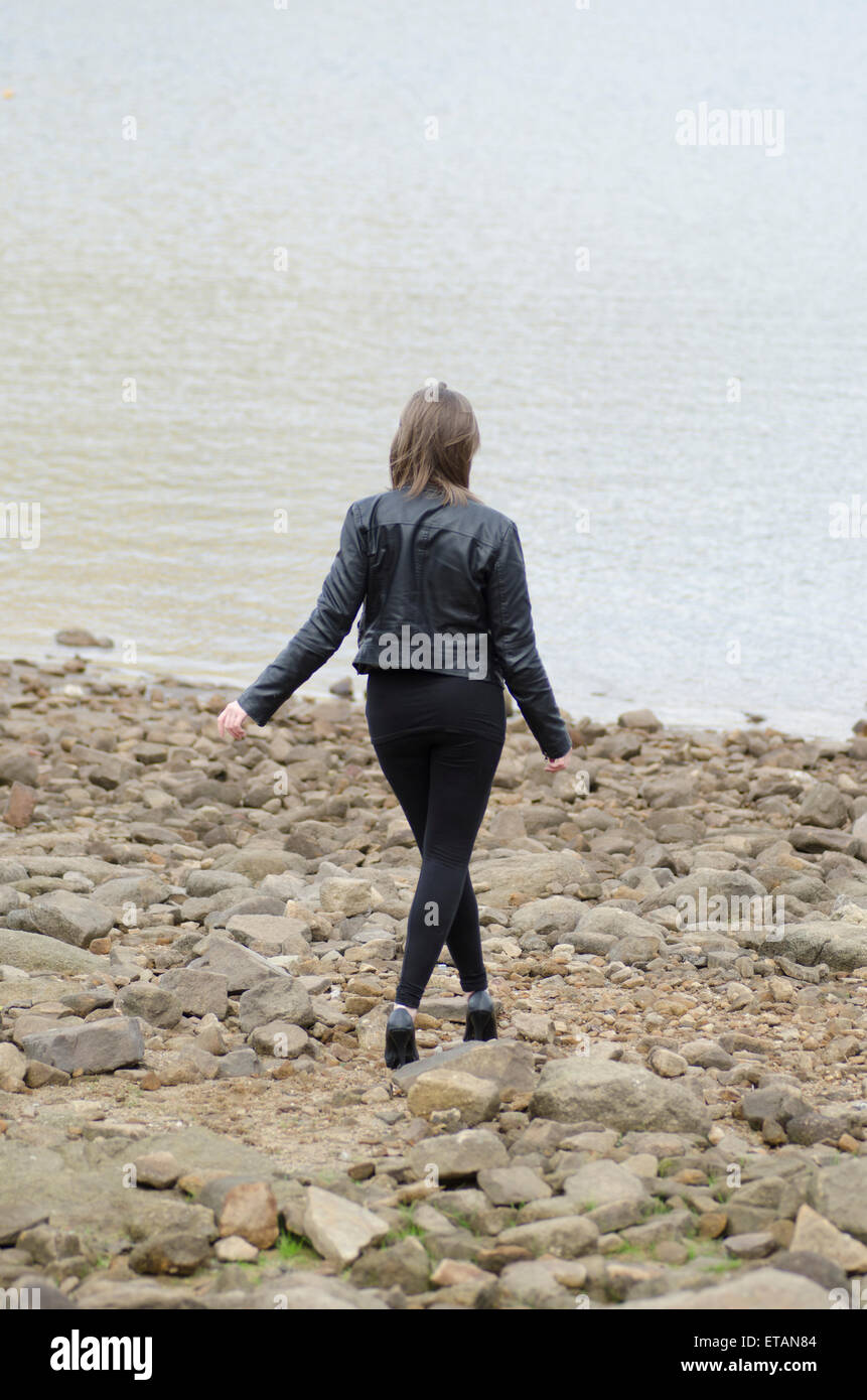 Woman walking seashore hi-res stock photography and images - Alamy
