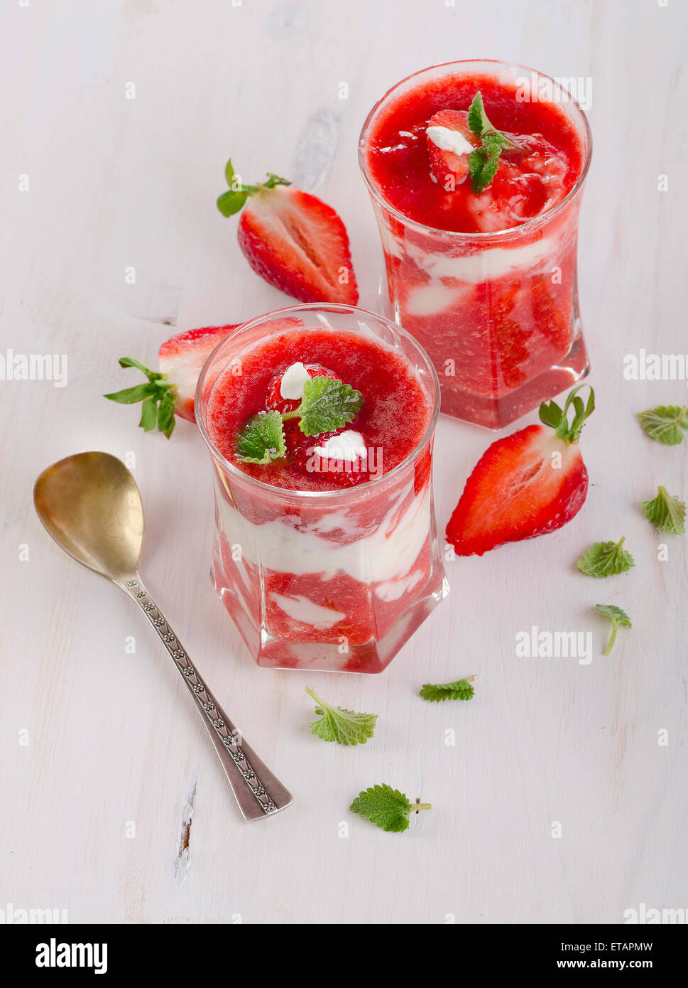 Glasses of Layered sweet Dessert with fresh mint Stock Photo - Alamy
