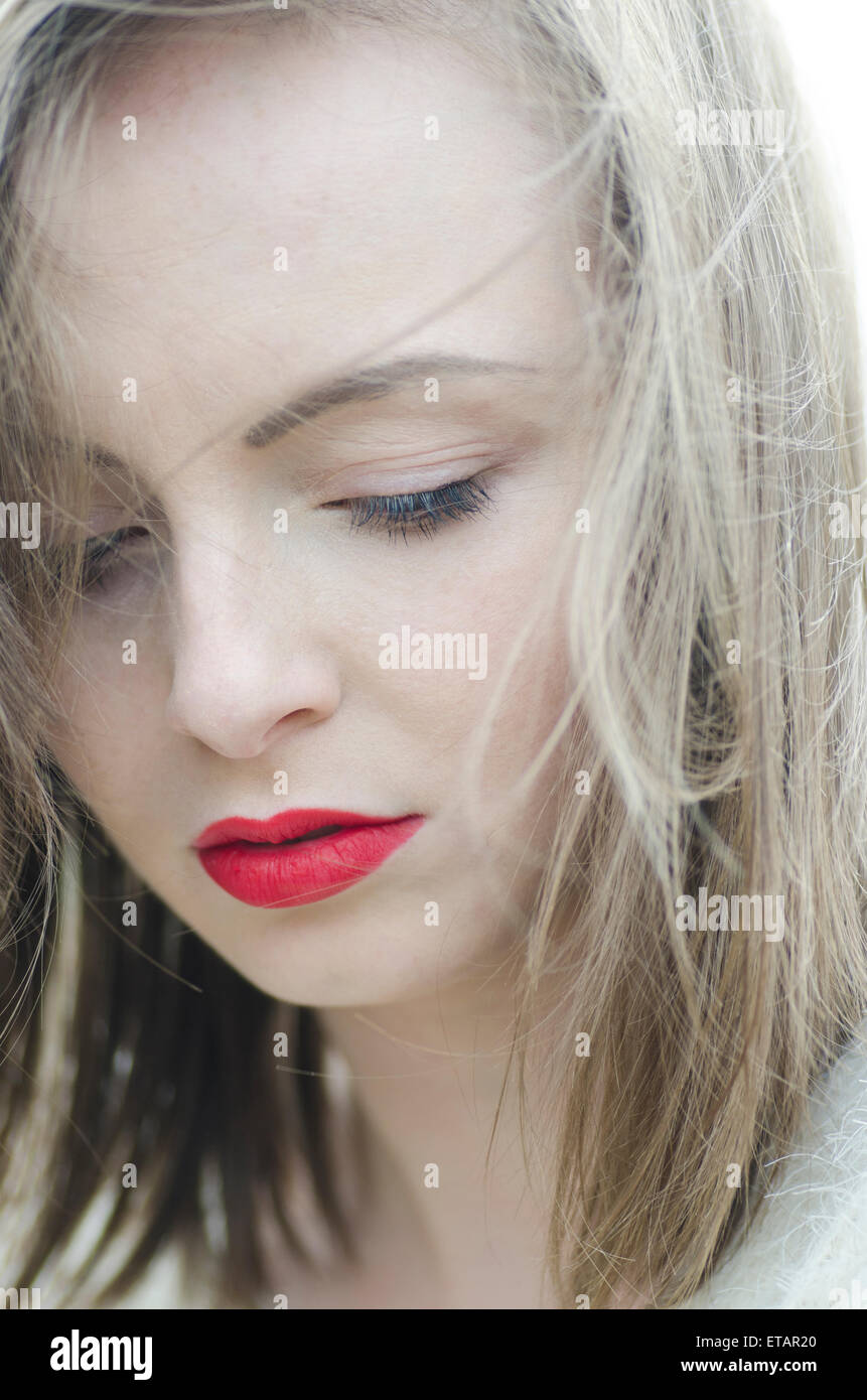 Beautiful young woman looking down Stock Photo - Alamy