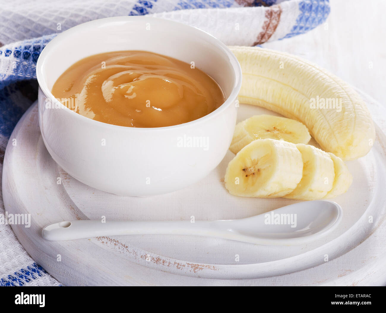 Baby food - bananas puree in a white bowl. Selective focus Stock Photo ...
