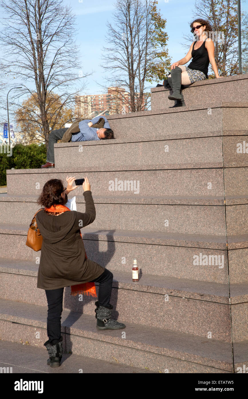 Photographer photographing model outside on Walker Art Center step-like ...