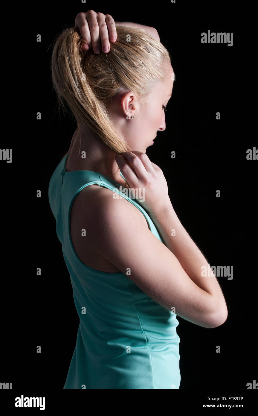 Young woman hands grabbing hair Stock Photo - Alamy