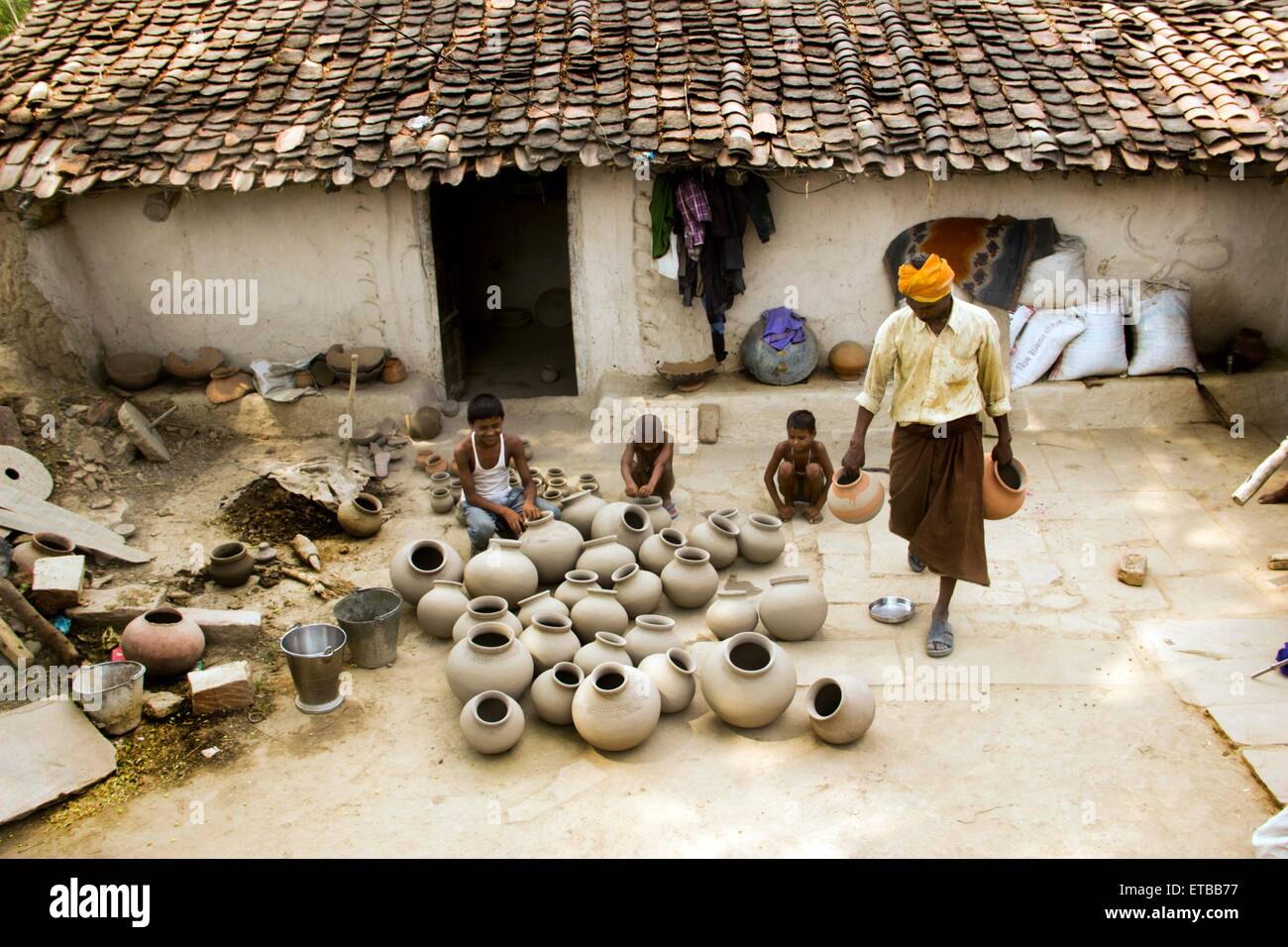 Karwi, India. 11th June, 2015. Potter making the earthen pots at Karwi ...