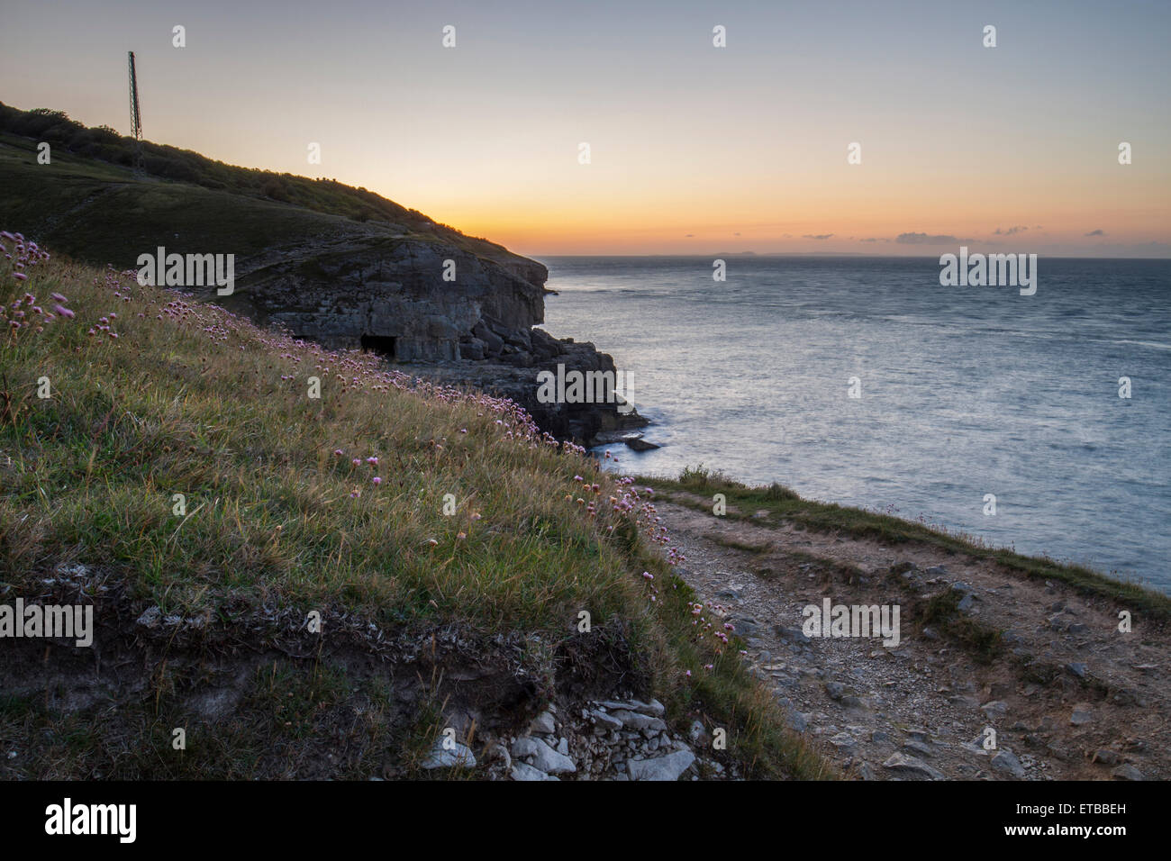 shipping marker at sunrise on cliffs on coastline Stock Photo - Alamy