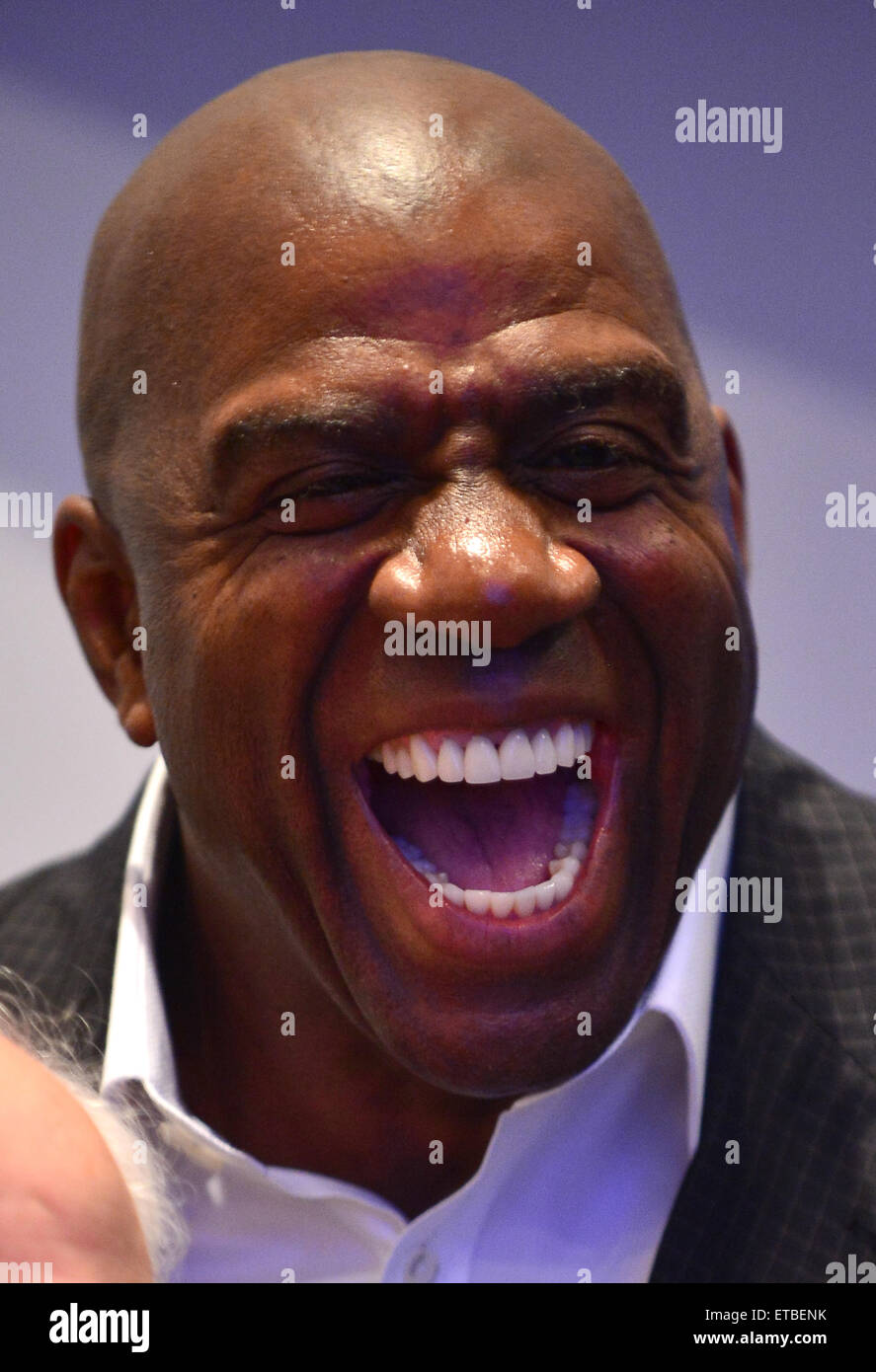Mike Fernandez is joined by NBA legend Magic Johnson at a presentation ...