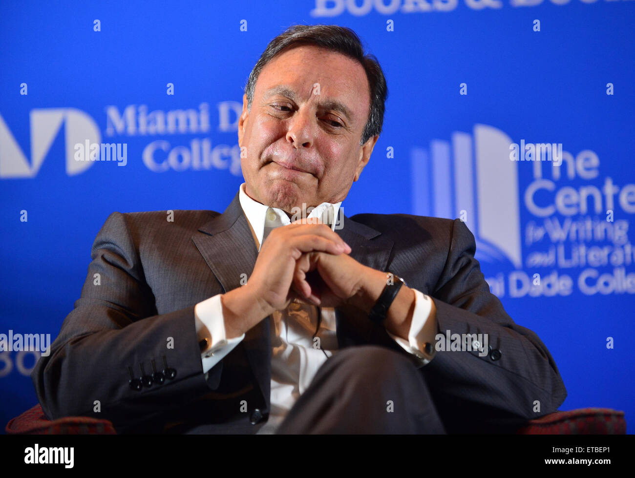 Mike Fernandez is joined by NBA legend Magic Johnson at a presentation ...