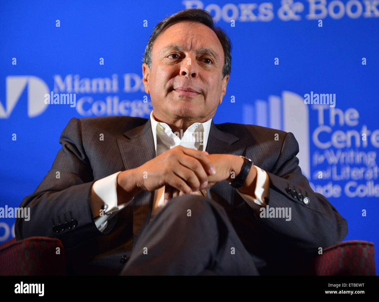 Mike Fernandez is joined by NBA legend Magic Johnson at a presentation ...