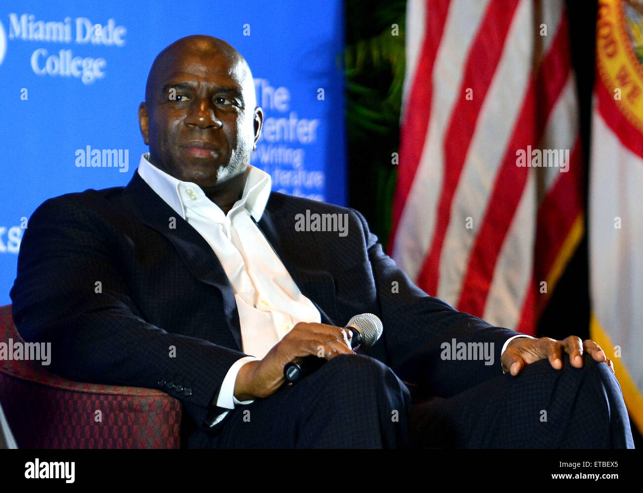 Mike Fernandez is joined by NBA legend Magic Johnson at a presentation ...