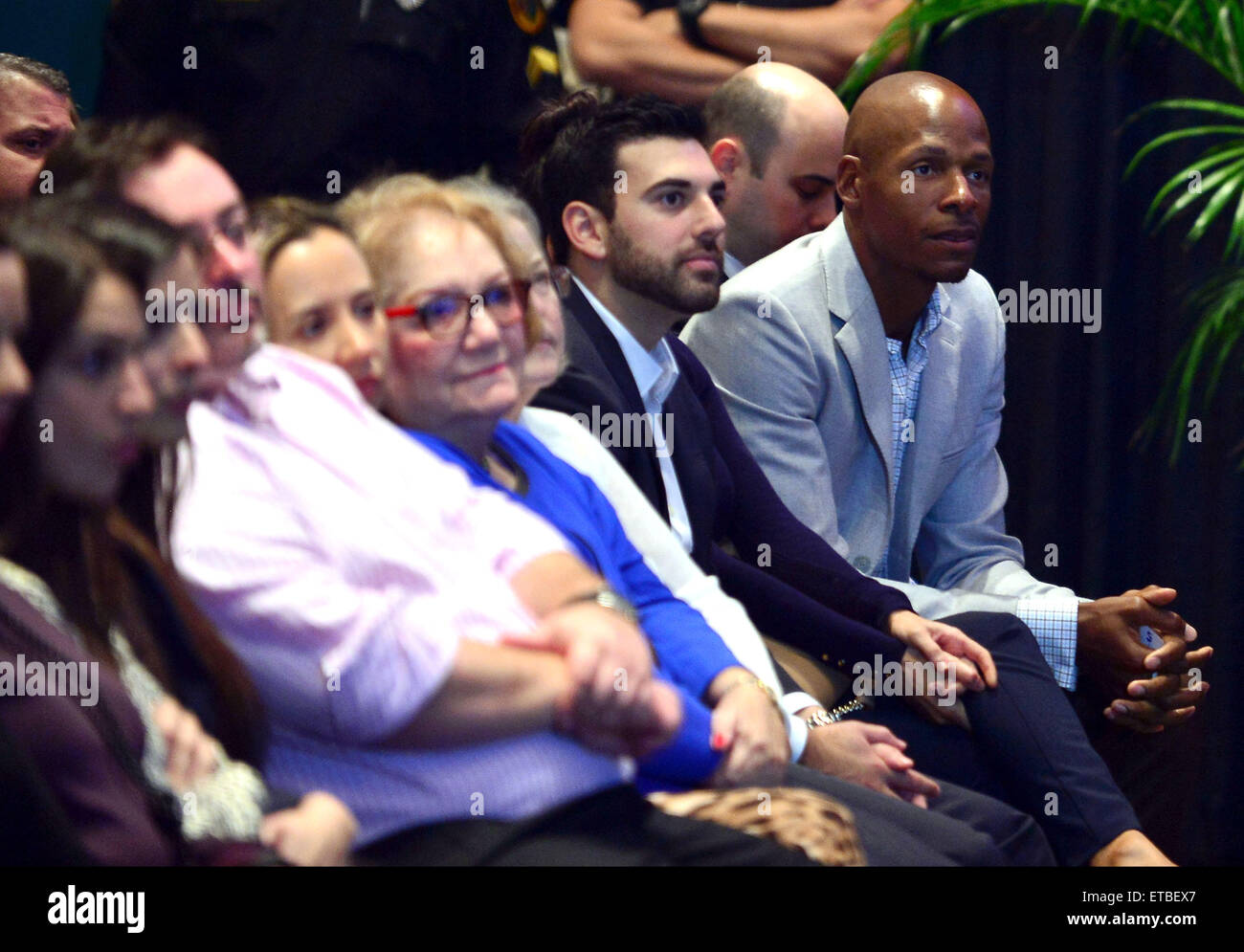 Mike Fernandez is joined by NBA legend Magic Johnson at a presentation ...