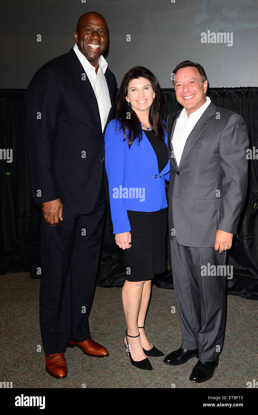 Mike Fernandez is joined by NBA legend Magic Johnson at a presentation ...