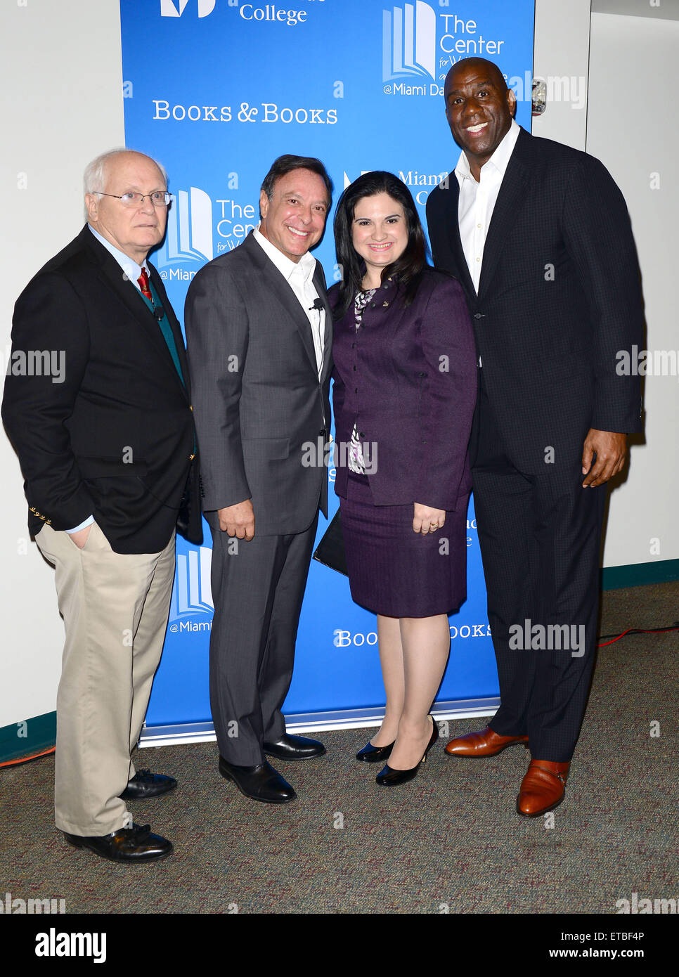 Mike Fernandez is joined by NBA legend Magic Johnson at a presentation ...