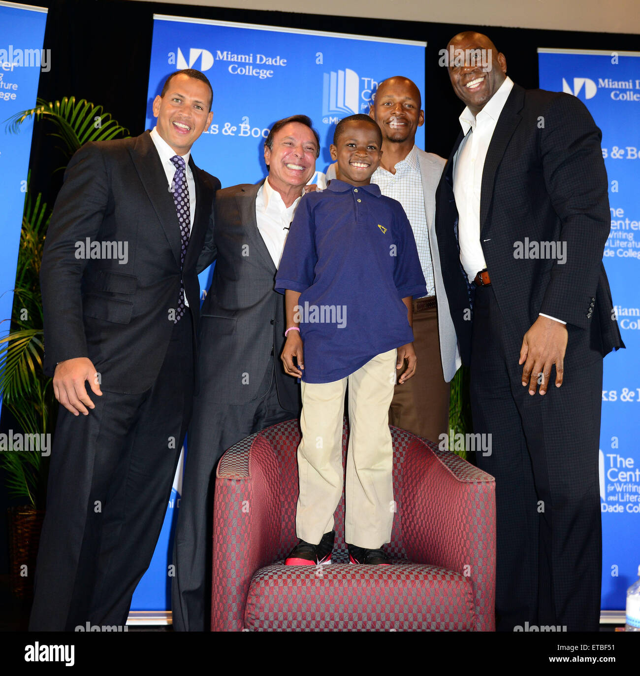 Mike Fernandez is joined by NBA legend Magic Johnson at a presentation ...