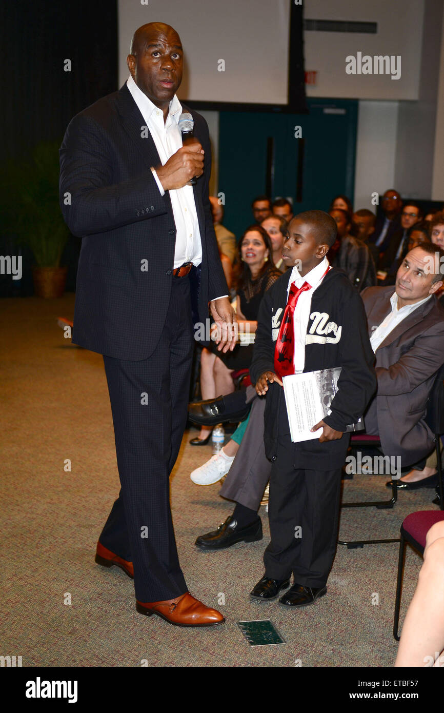 Mike Fernandez is joined by NBA legend Magic Johnson at a presentation ...